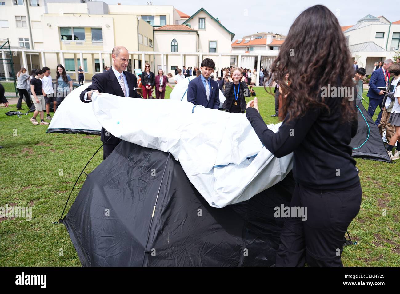 The Duke of Edinburgh assembling a tent at Oporto British School in ...