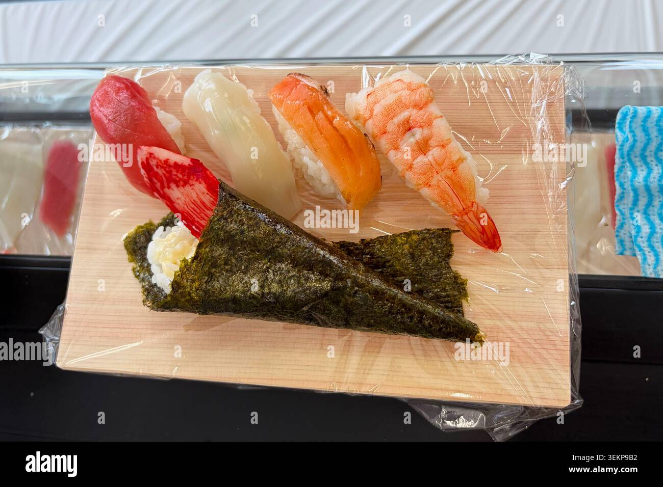 The pieces of sushi that just got made by Tsuneo Suzuki, a master sushi ...