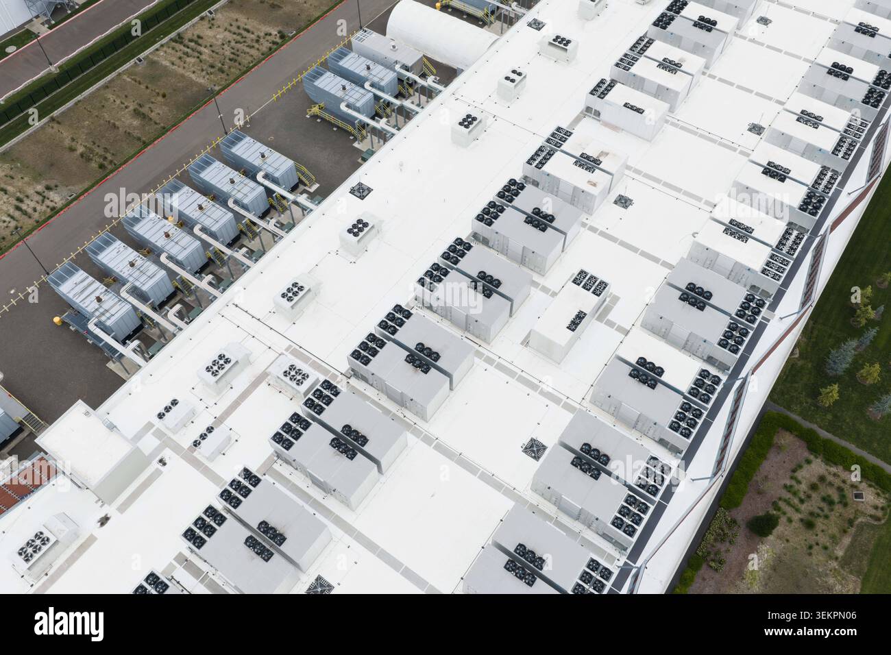 FILE - Fans, part of a cooling system, are visible on the roof of a ...
