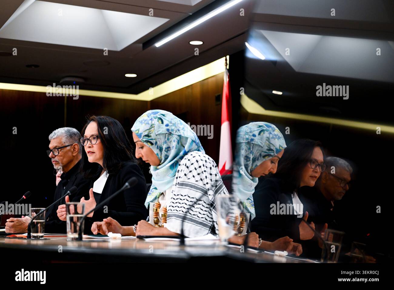 NDP MP Jenny Kwan, second left, speaks during a press conference at the ...