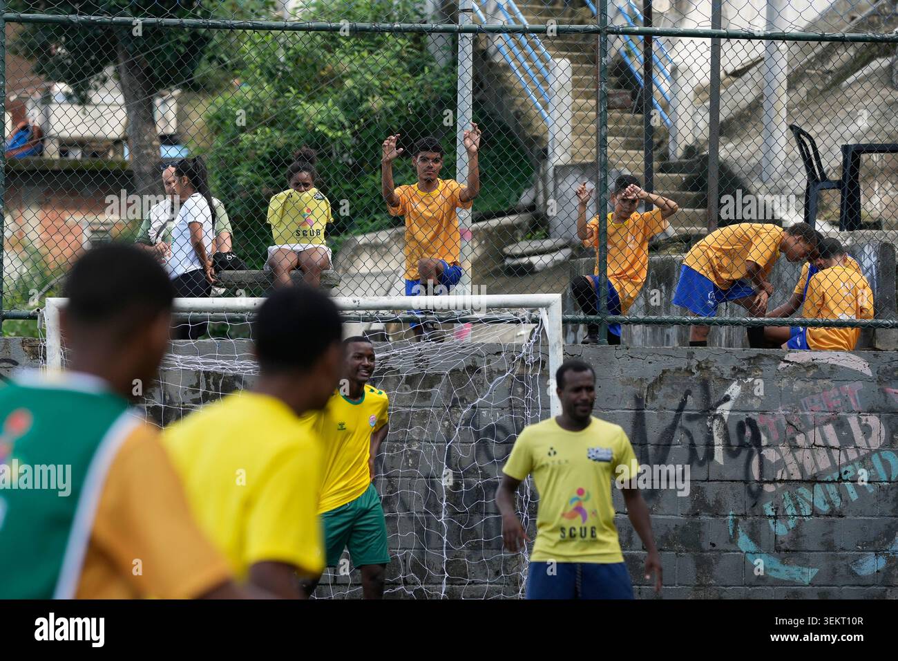 Youths attend soccer training by the Street Child United Brazil social ...
