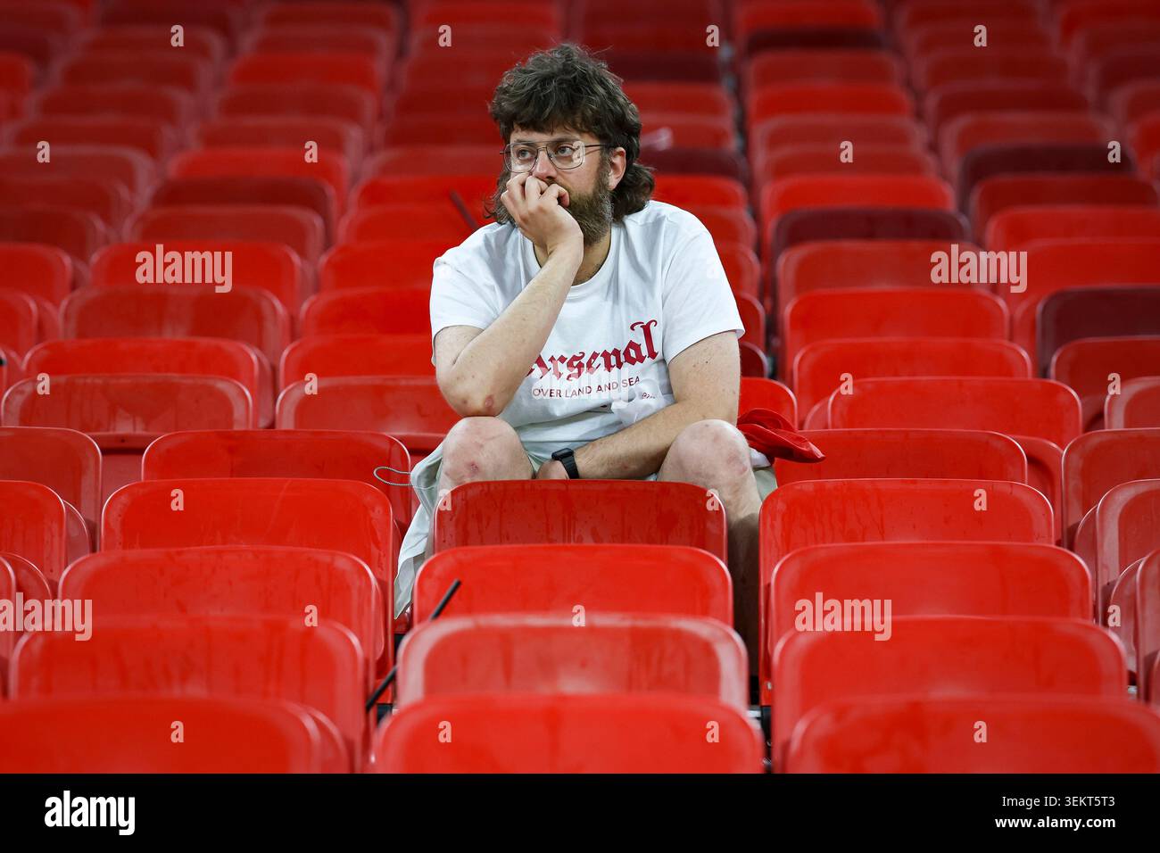 Dejected Arsenal fan after the Paris Saint-Germain v Arsenal UEFA ...