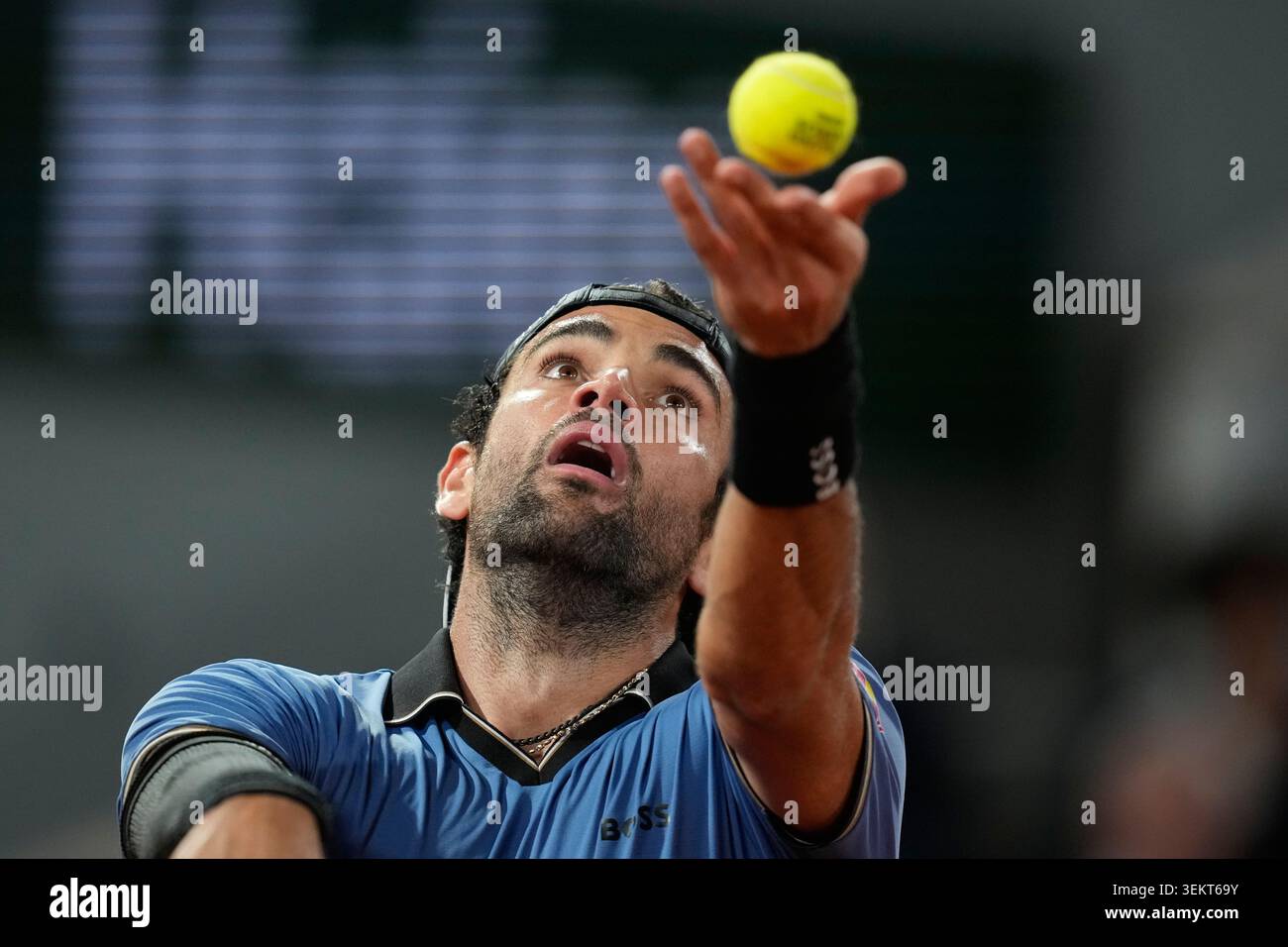 Italy's Matteo Berrettini serves to Italy's Matteo Arnaldi during the ...