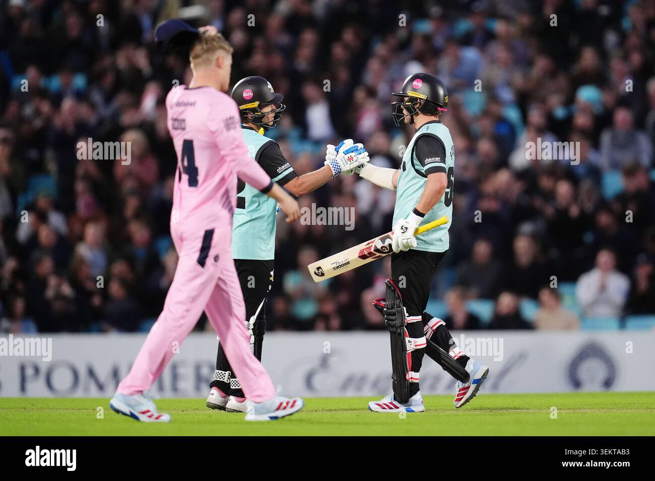 Surrey's Ollie Pope (centre left) and Sam Curran after the Vitality ...