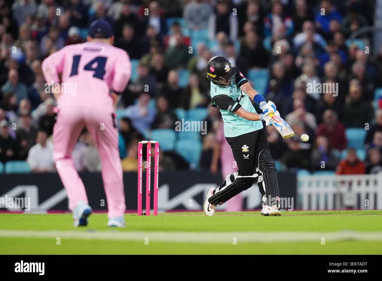 Surrey's Ollie Pope (right) hits the winning run during the Vitality ...