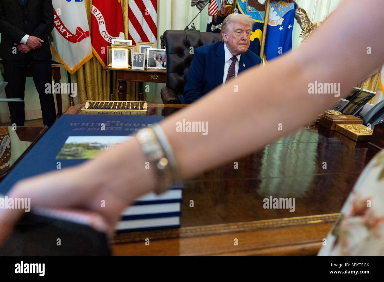 An aide directs reporters to leave after President Donald Trump spoke ...