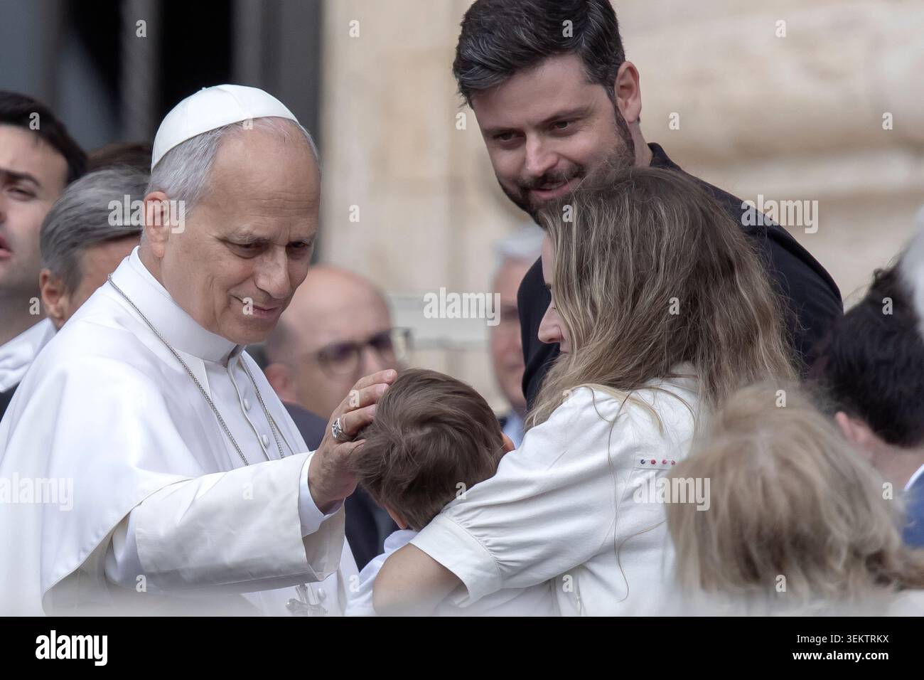 Pope Leo XIV greets a family during his weekly general audience in St ...