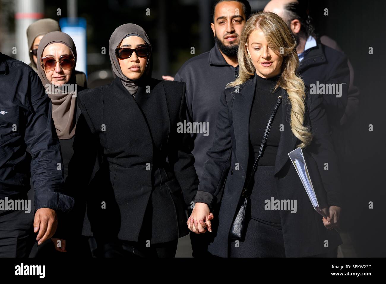 Sarah Abu Lebdeh (centre) arrives at Downing Centre Local Court, Sydney ...