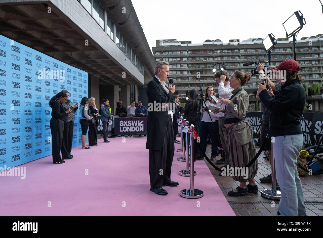 Richard E. Grant being interviewed by the press at the Savage House ...