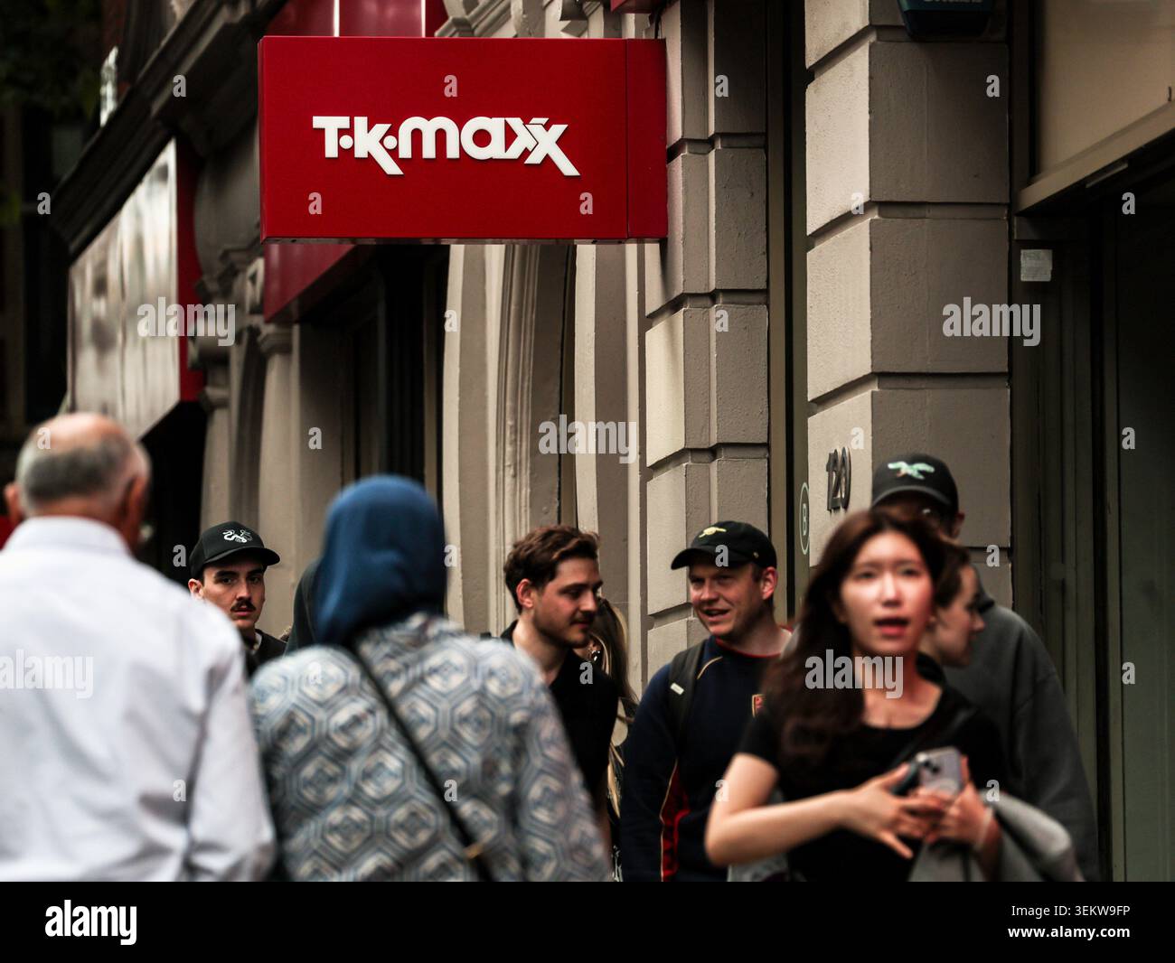 TKMAXX logo is seen as people walk in front of the shop on landmark ...