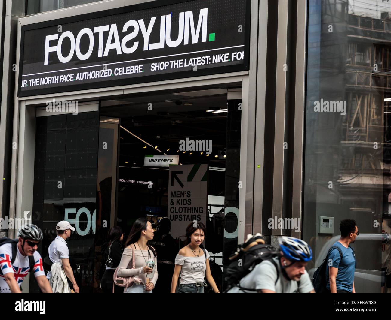 Footasylum logo is seen as people walk in front of the shop on landmark ...