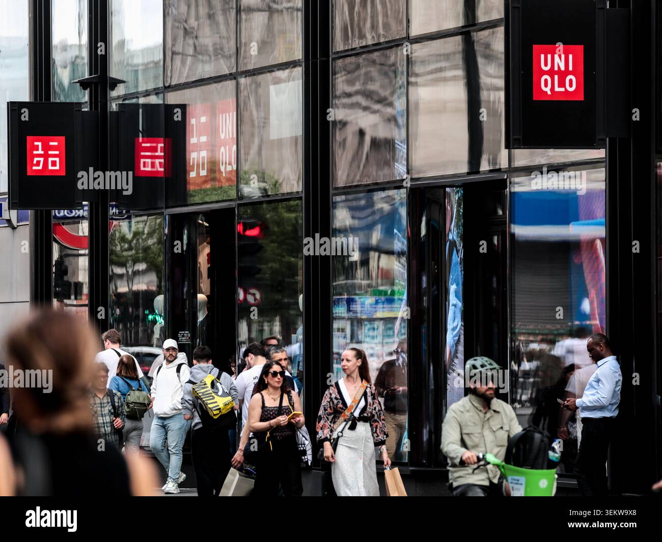 UNIQLO logo is seen as people walk in front of the shop on landmark ...
