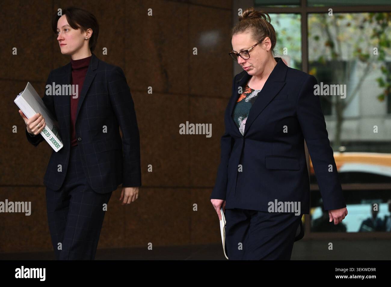 Defence barrister Grace Morgan (right) leaves the Melbourne Magistrates ...
