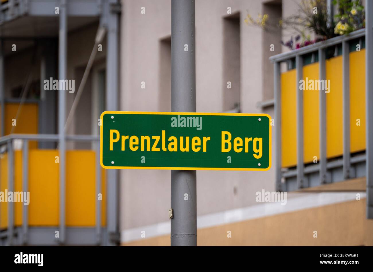 03 June 2026, Berlin: A "Prenzlauer Berg" sign hangs from a lamp post ...