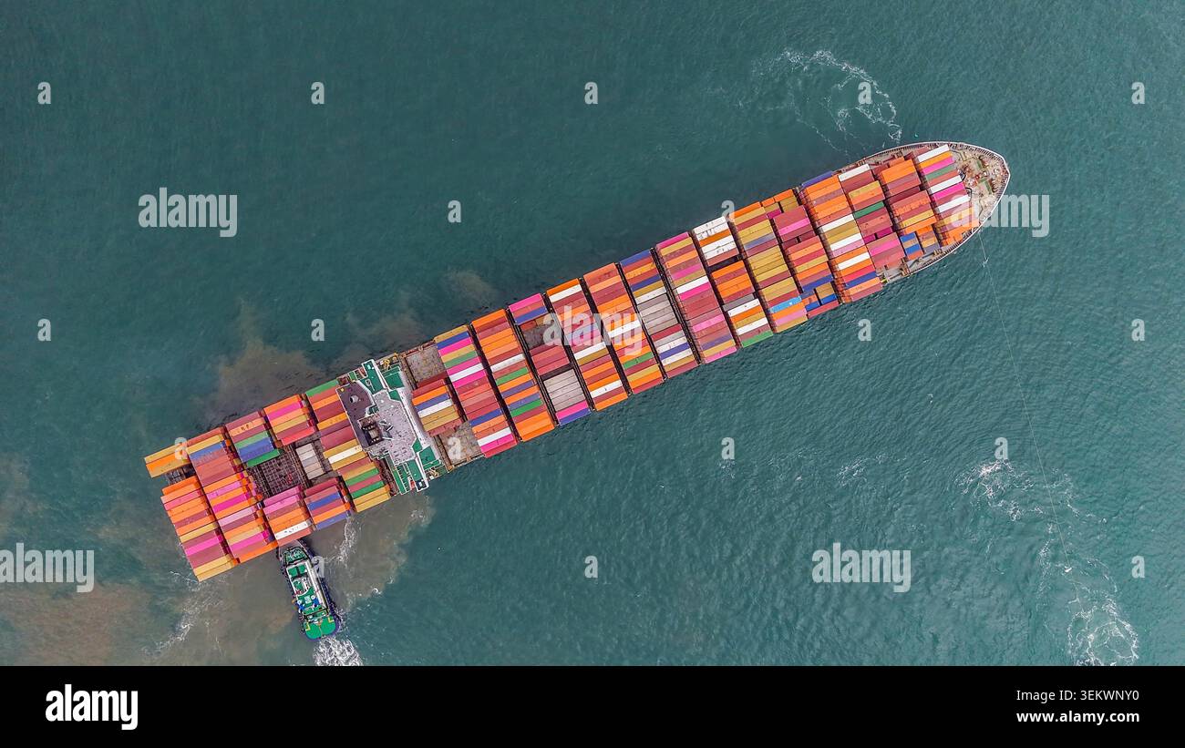 Workers handle cargo at Qingdao Port in east China's Shandong Province ...