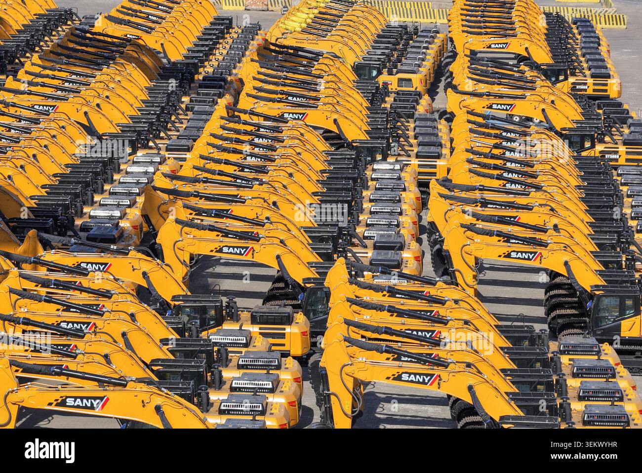 Excavators from Sany Group await export at a storage yard in Yantai ...