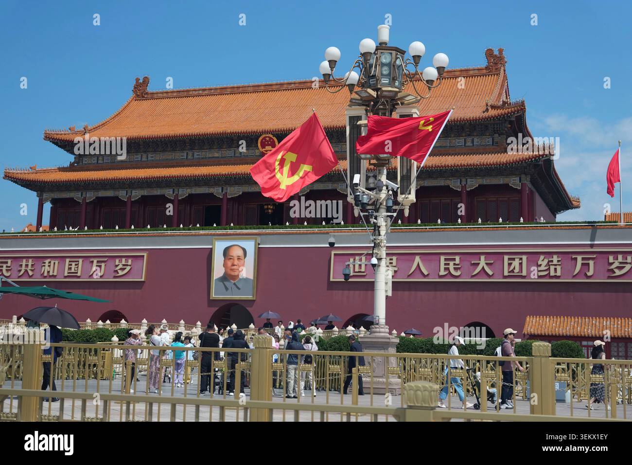 Flags bearing the hammer and sickle flags are flown in front of ...