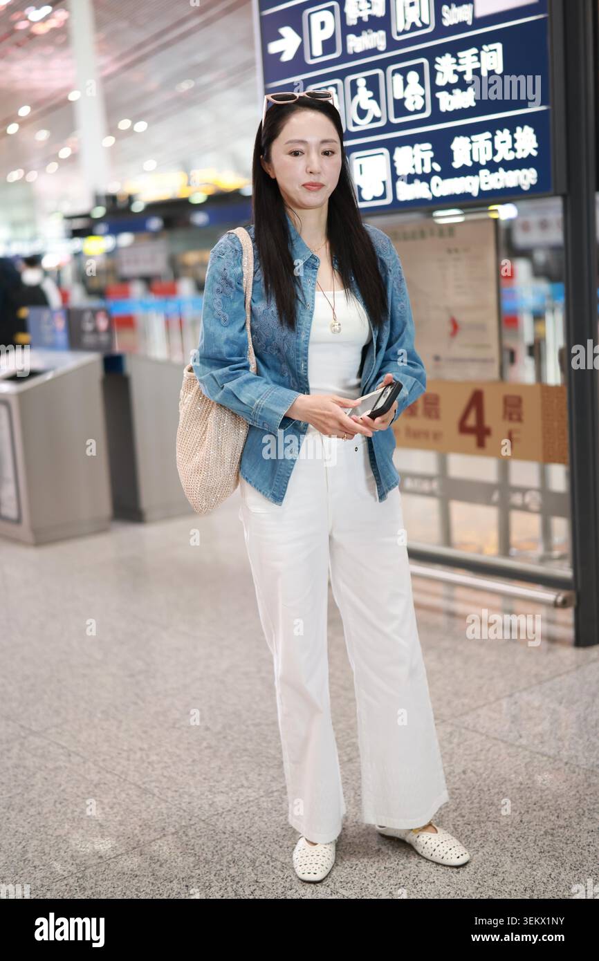 Chinese actress Dong Xuan arrives at Beijing Capital International ...