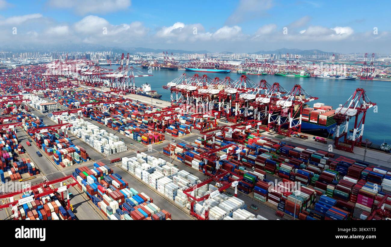 Workers transport foreign trade containers at Qingdao Port in east ...