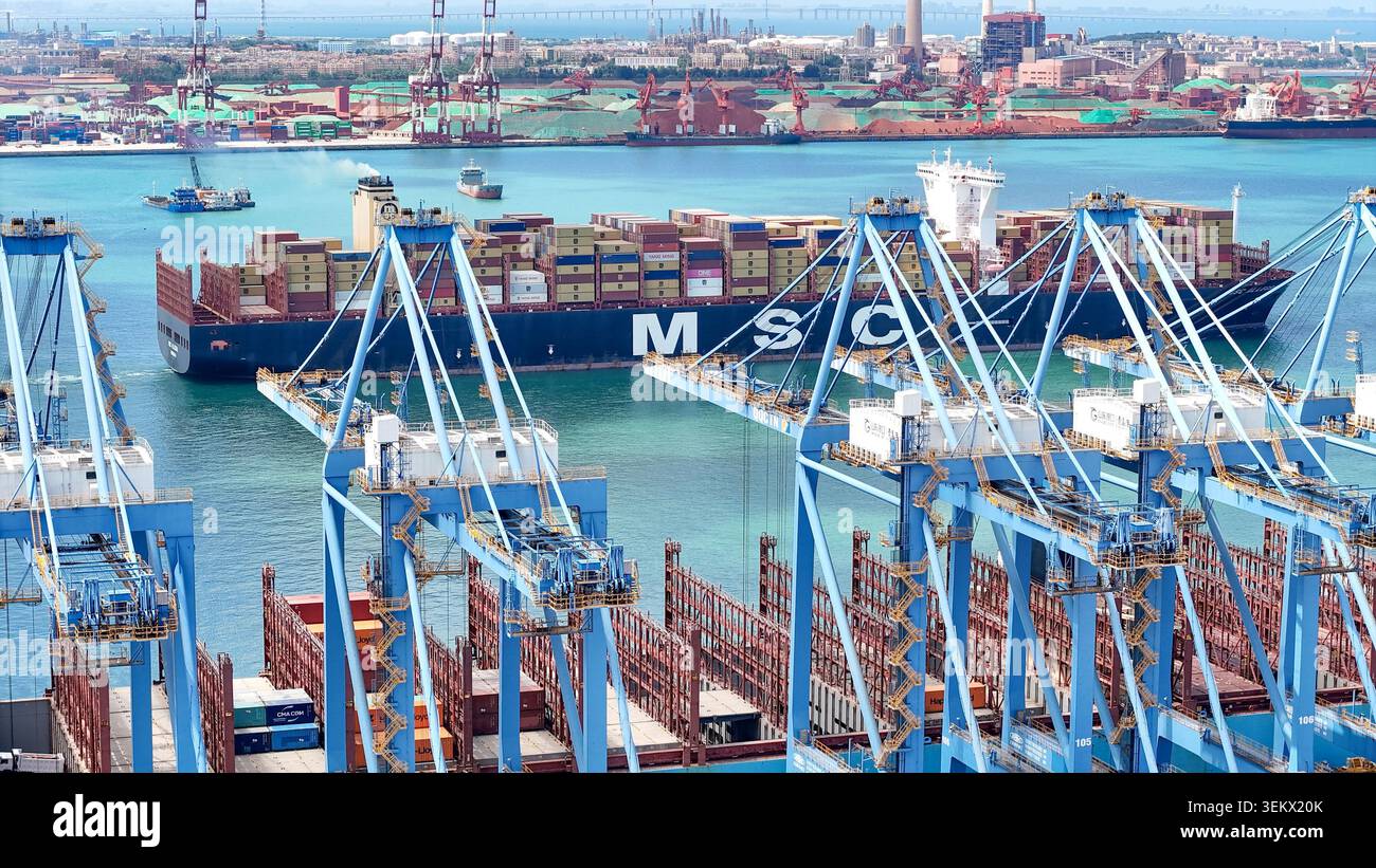 A cargo ship departs slowly from the fully automated terminal at ...