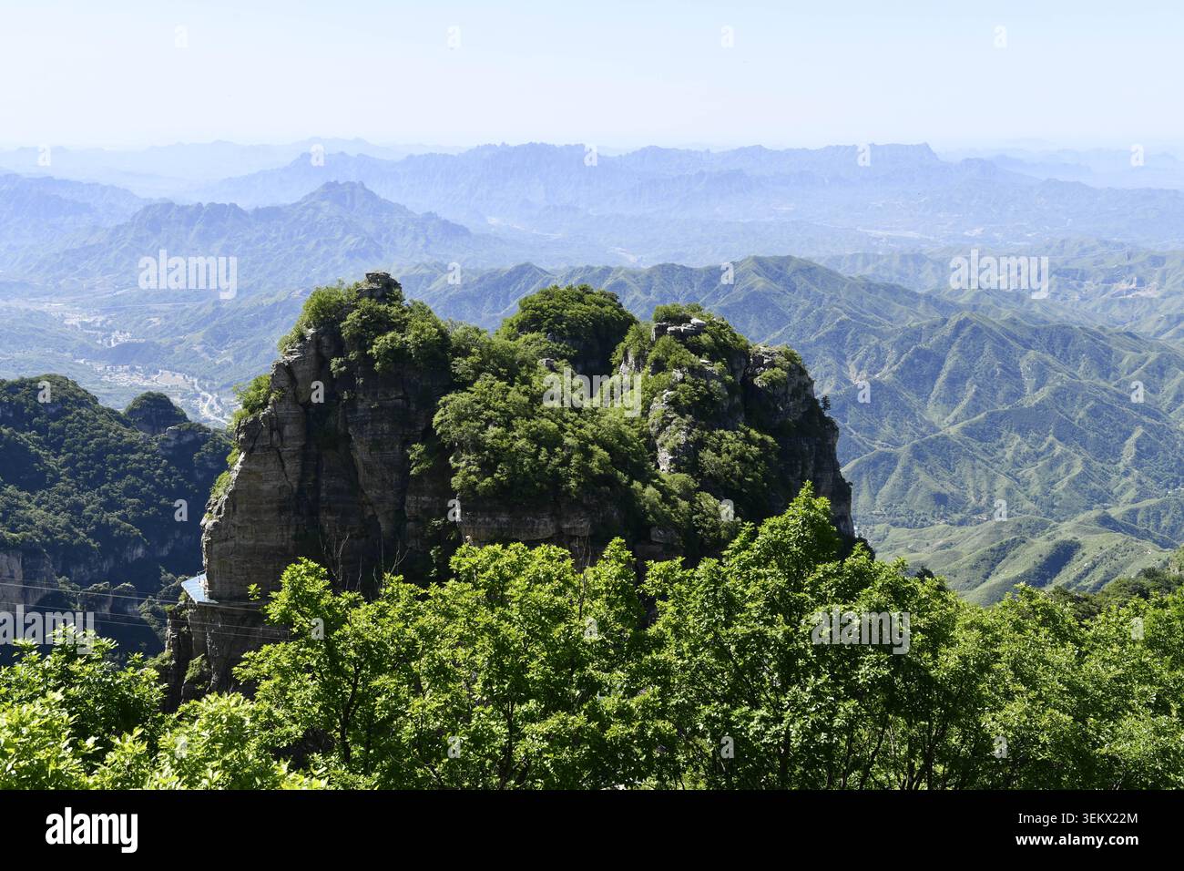 Tourists visit the snow-covered rocks at Baiyun Mountain Scenic Area in ...