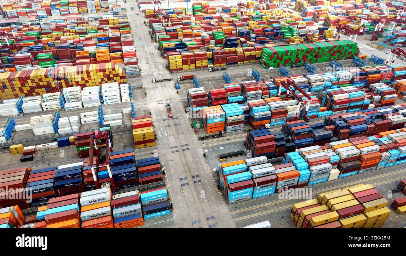 Workers transport foreign trade containers at Qingdao Port in east ...
