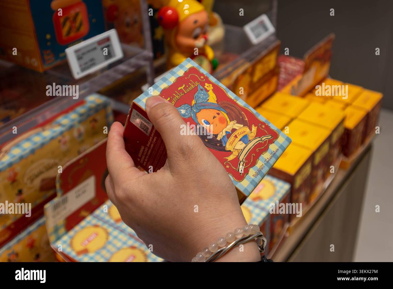Customers browse blind box toys at a POP MART store in The Londoner ...