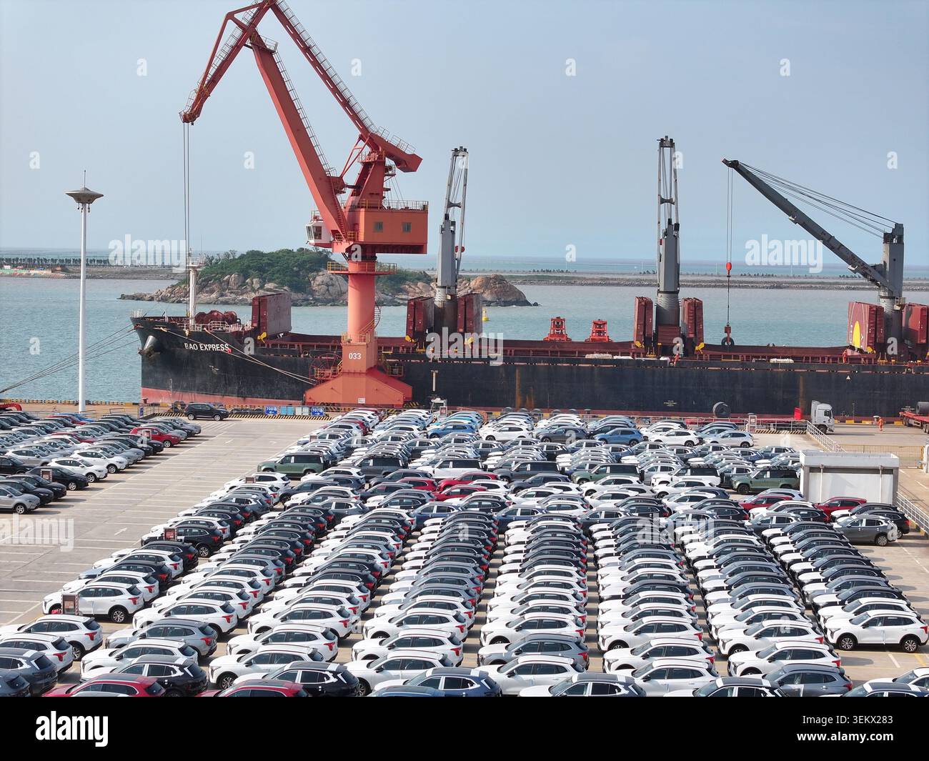 Workers load Chinese-made vehicles for export at Lianyungang Port in ...