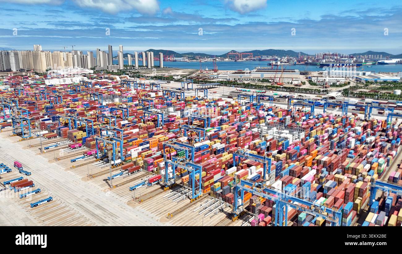 Containers are seen at the automated terminal of Shandong Port Qingdao ...