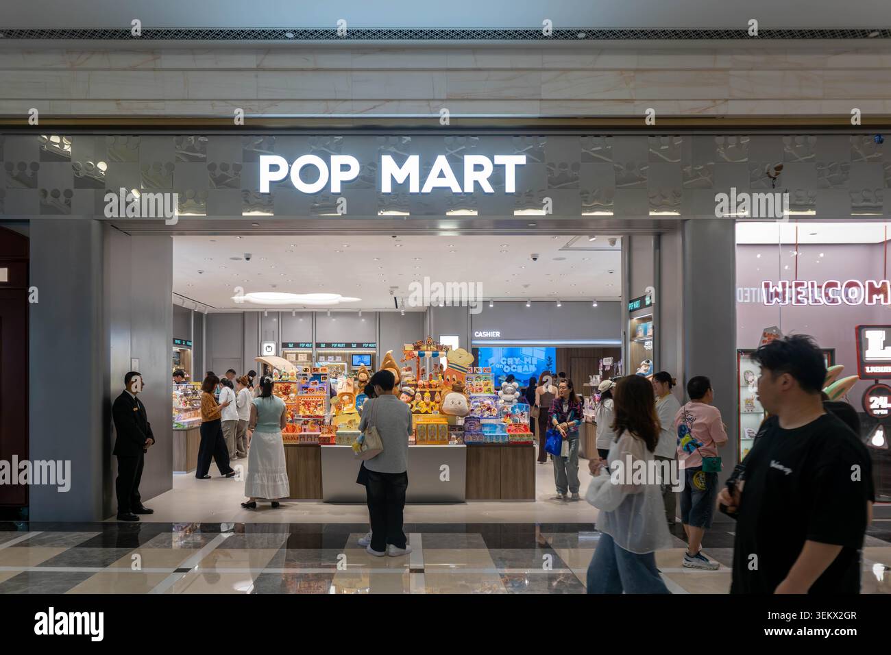 Customers browse blind box toys at a POP MART store in The Londoner ...