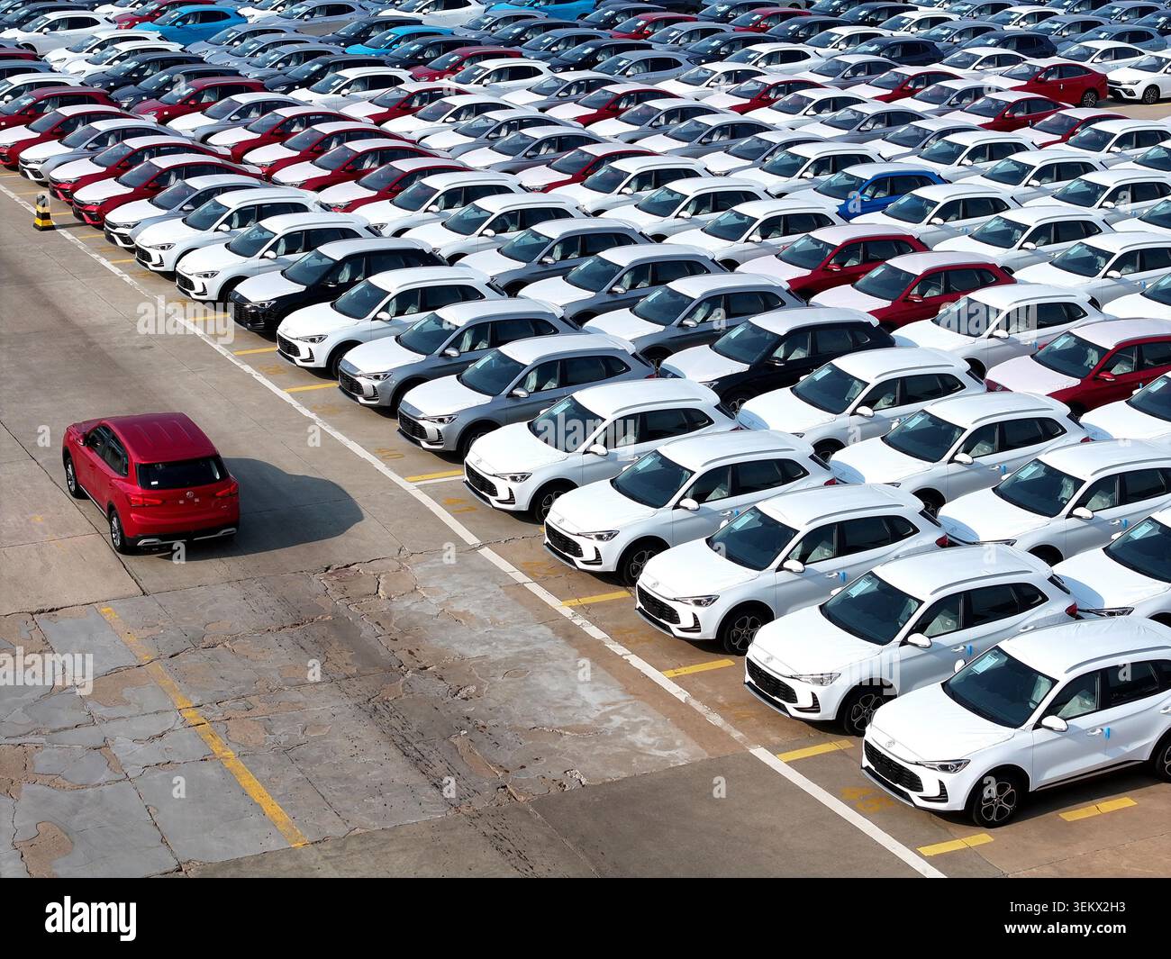 Workers load Chinese-made vehicles for export at Lianyungang Port in ...