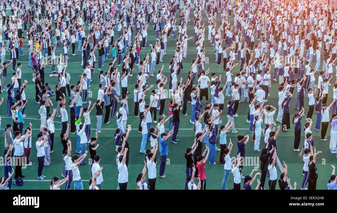 Over 1,900 senior high school students practice yoga under professional ...