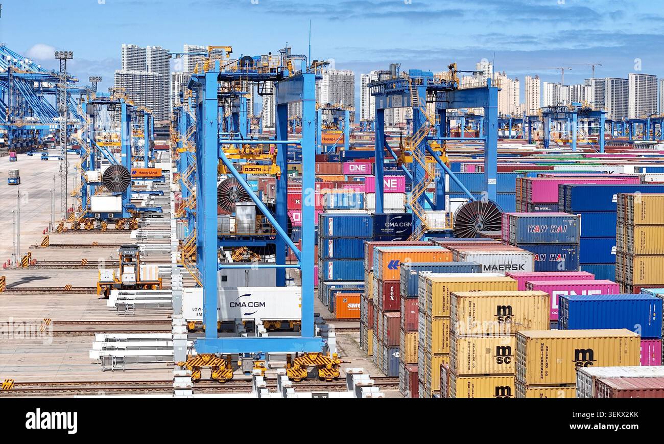 Automated cranes transport goods at Qingdao Port in east China's ...