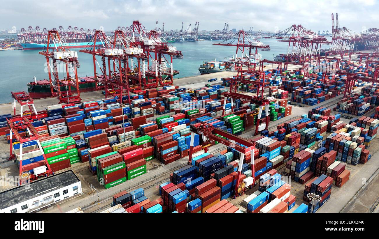 Workers transport foreign trade containers at Qingdao Port in east ...