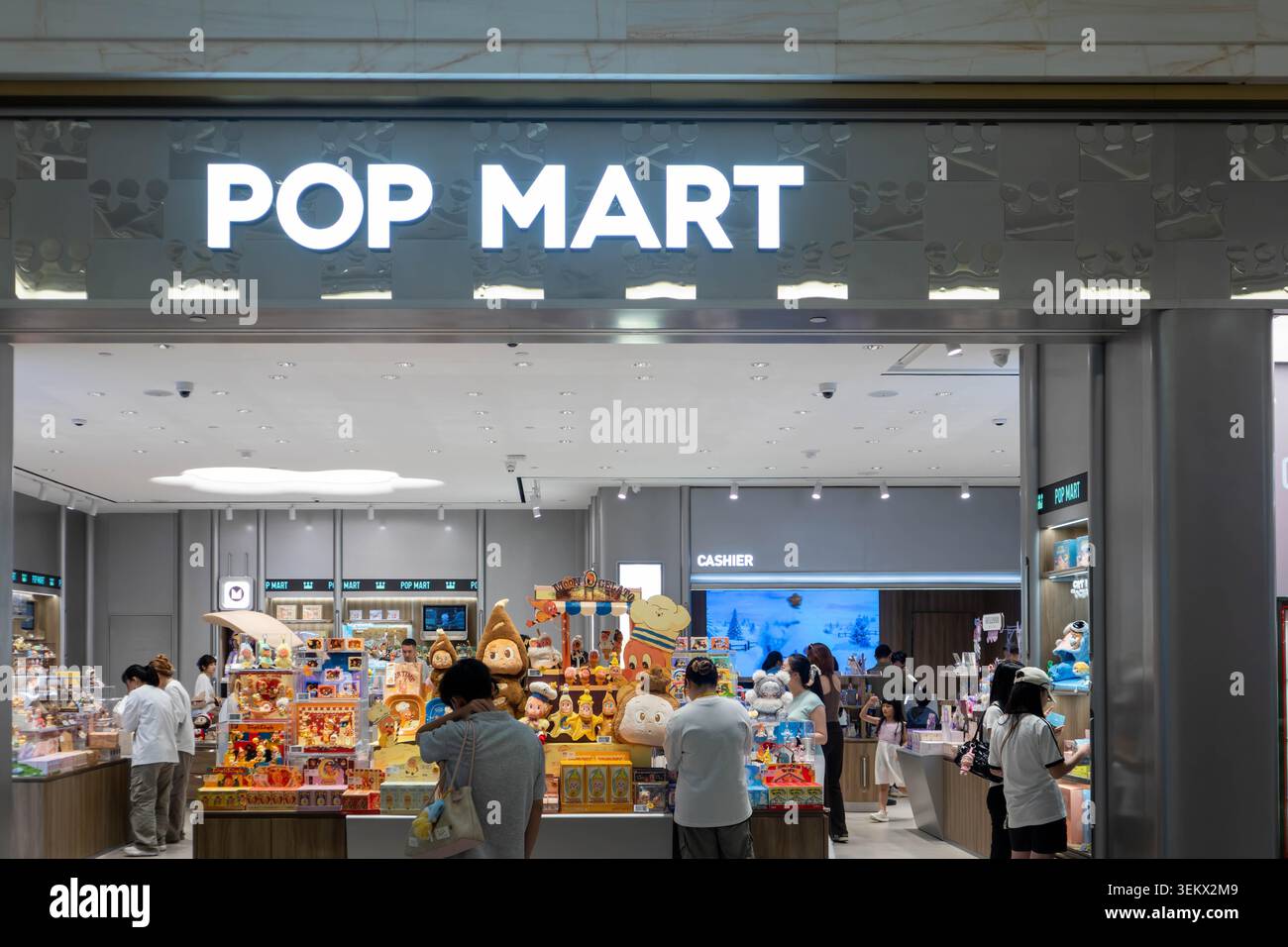 Customers browse blind box toys at a POP MART store in The Londoner ...