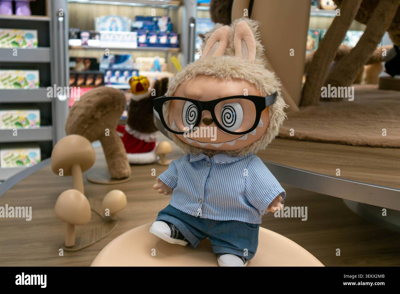 Customers browse blind box toys at a POP MART store in The Londoner ...