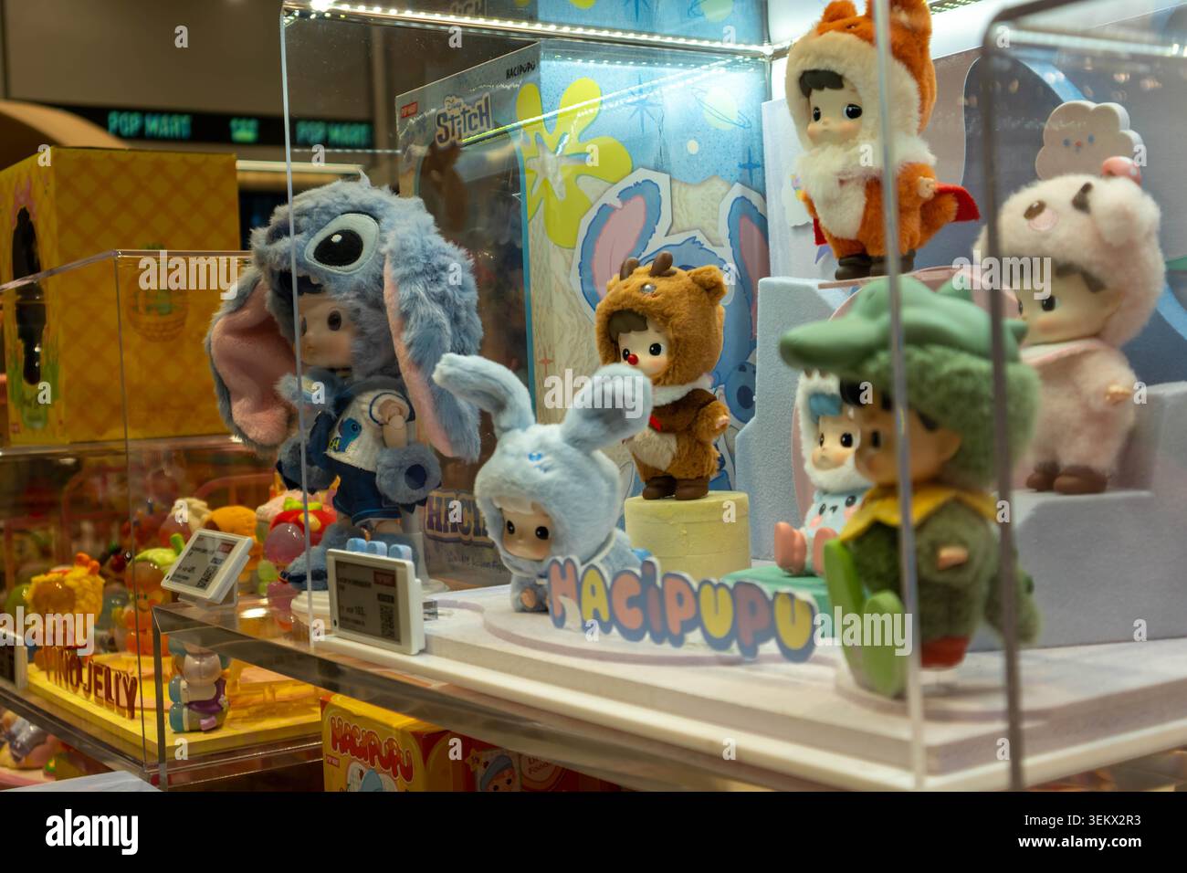 Customers browse blind box toys at a POP MART store in The Londoner ...
