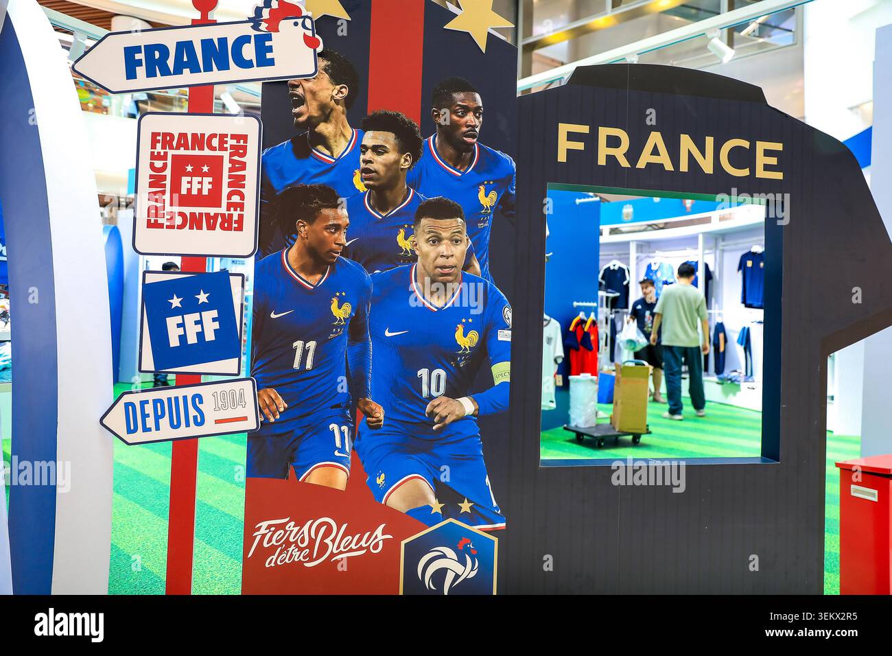 A stall sells official merchandise of World Cup teams including ...