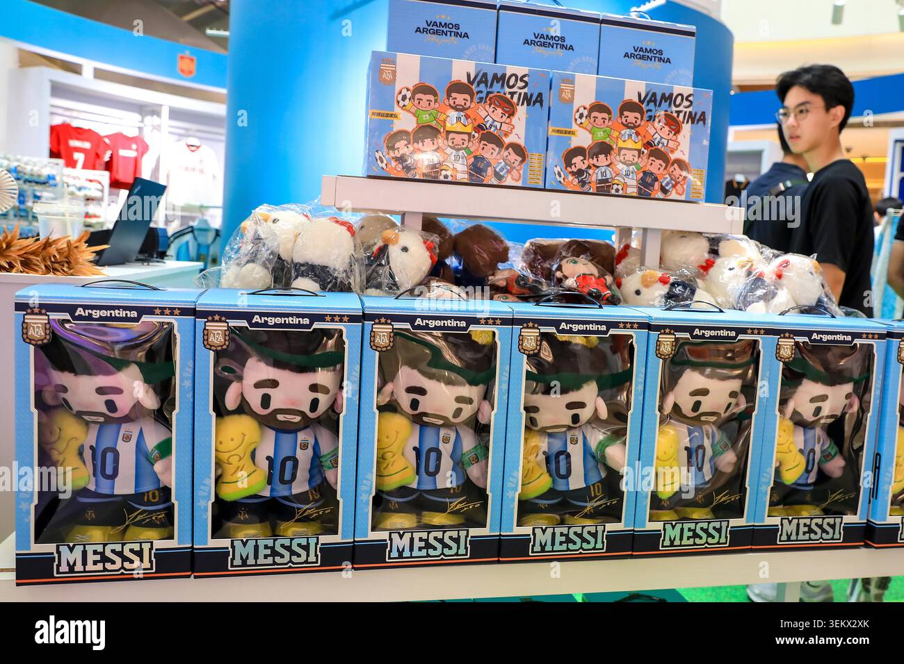 A stall sells official merchandise of World Cup teams including ...