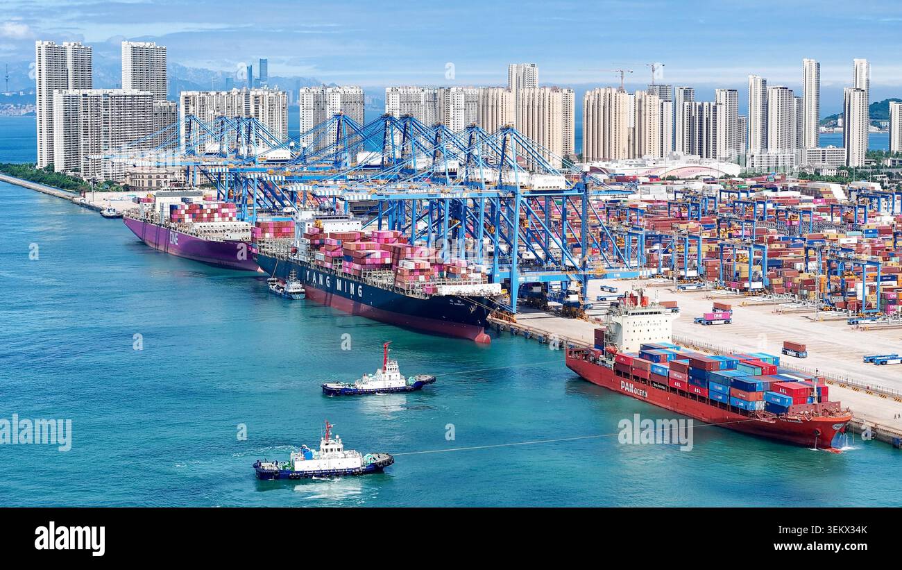 A cargo ship departs slowly from the fully automated terminal at ...