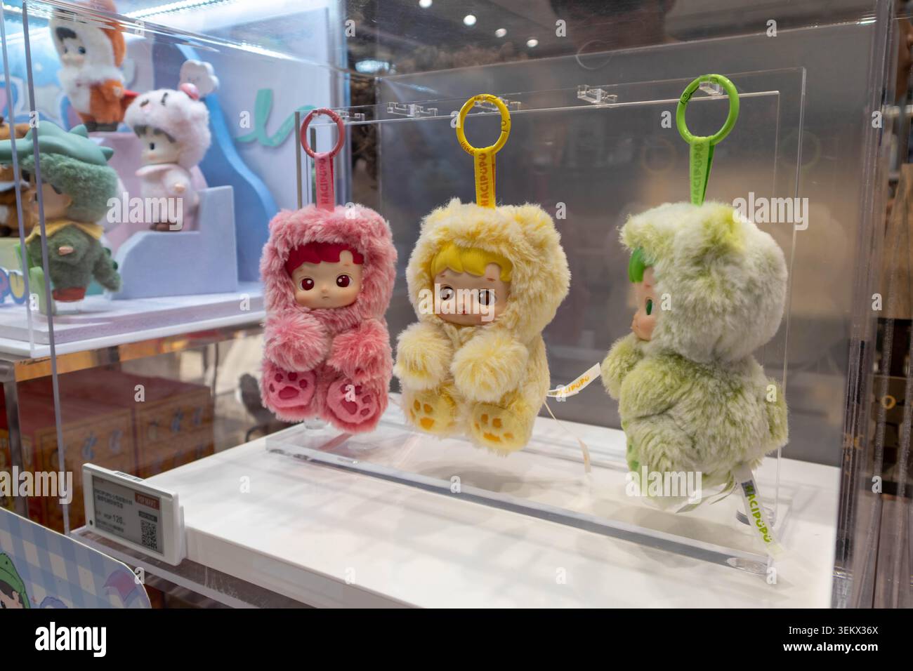 Customers browse blind box toys at a POP MART store in The Londoner ...