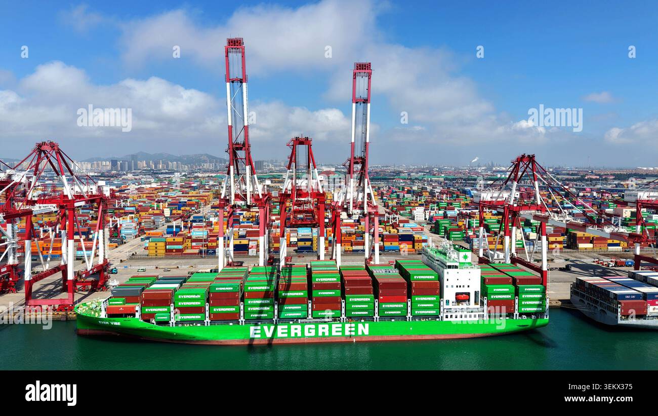 Workers transport foreign trade containers at Qingdao Port in east ...