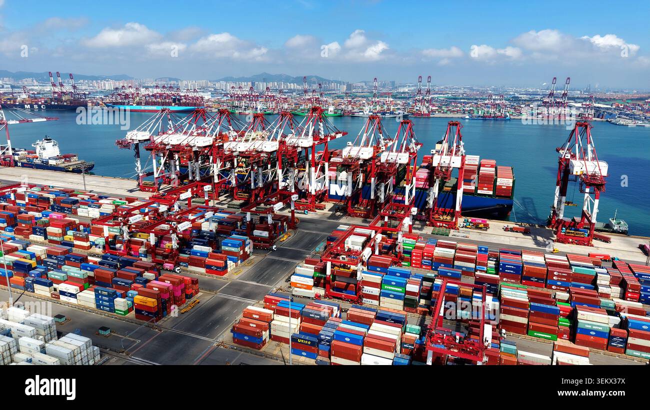 Workers transport foreign trade containers at Qingdao Port in east ...
