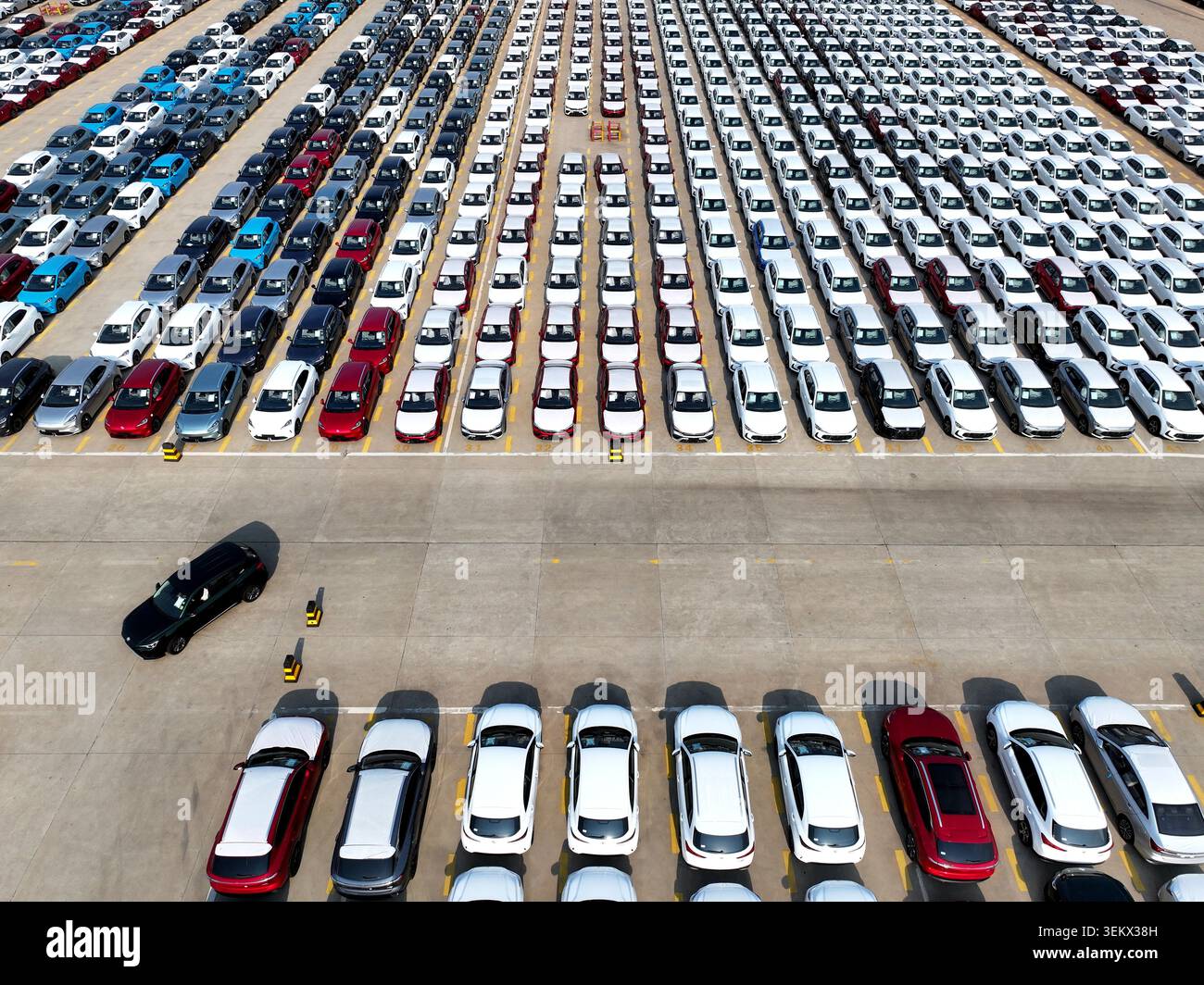 Workers load Chinese-made vehicles for export at Lianyungang Port in ...
