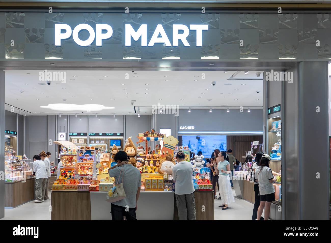 Customers browse blind box toys at a POP MART store in The Londoner ...