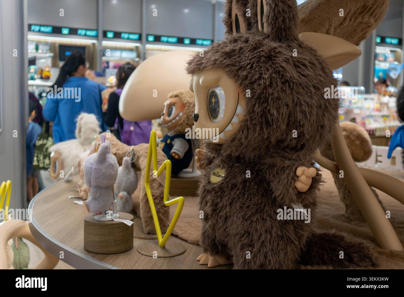 Customers browse blind box toys at a POP MART store in The Londoner ...