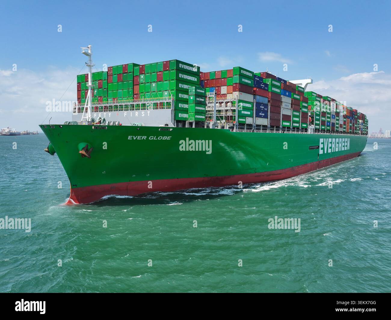 Large container ships loaded with foreign trade goods arrive at or ...