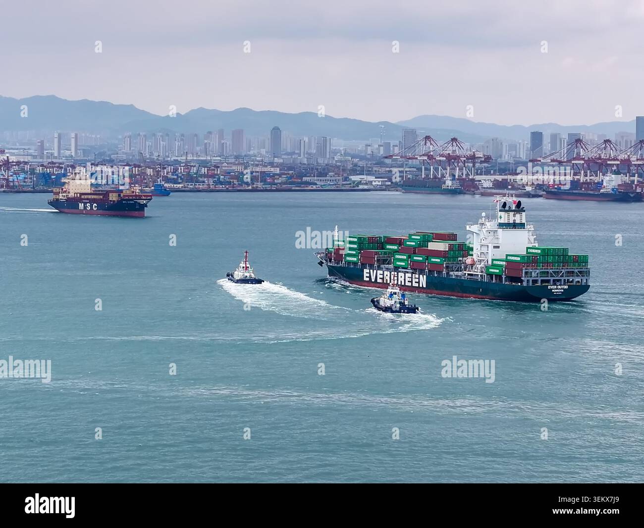 Large container ships loaded with foreign trade goods arrive at or ...