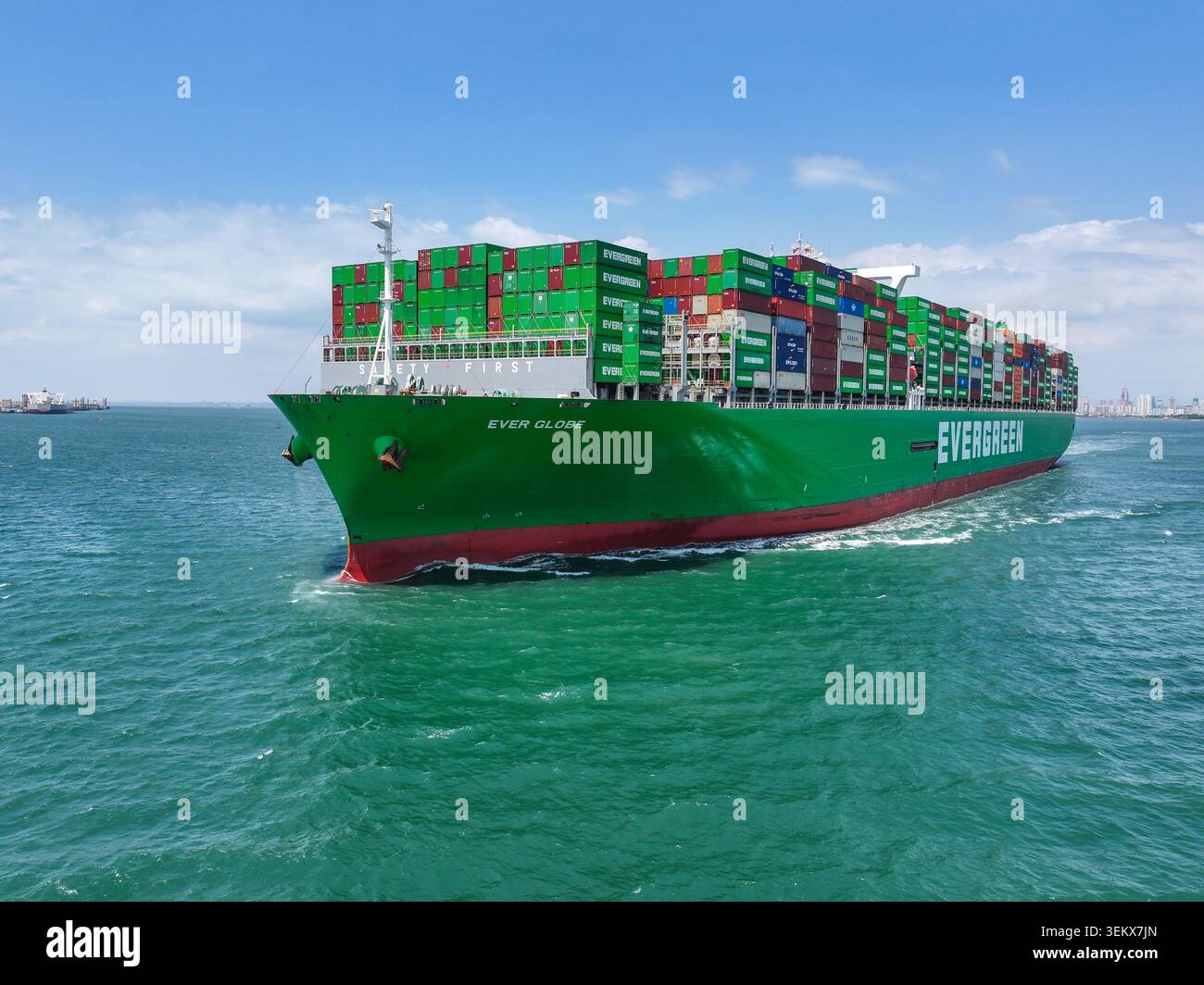 Large container ships loaded with foreign trade goods arrive at or ...