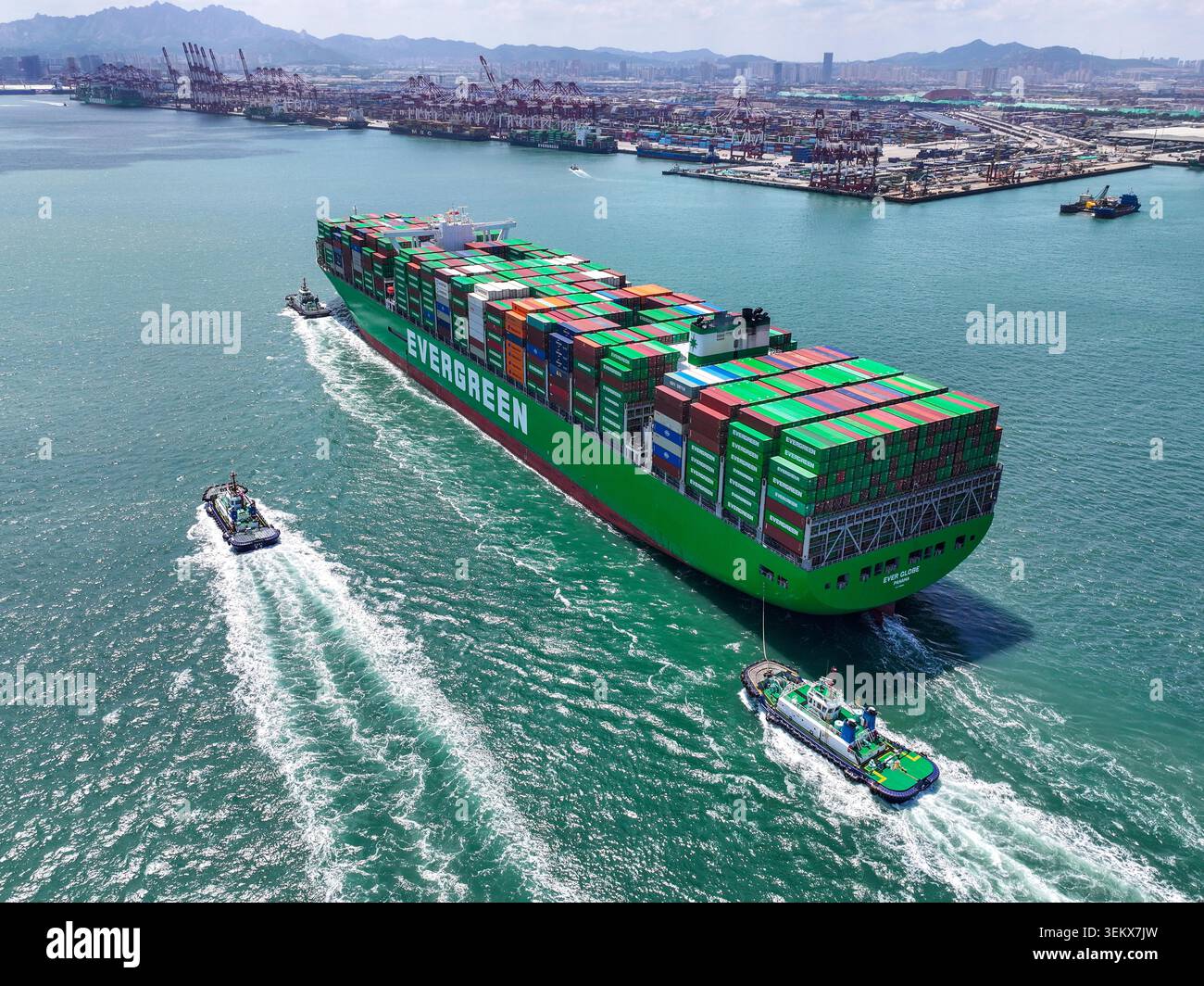 Large container ships loaded with foreign trade goods arrive at or ...